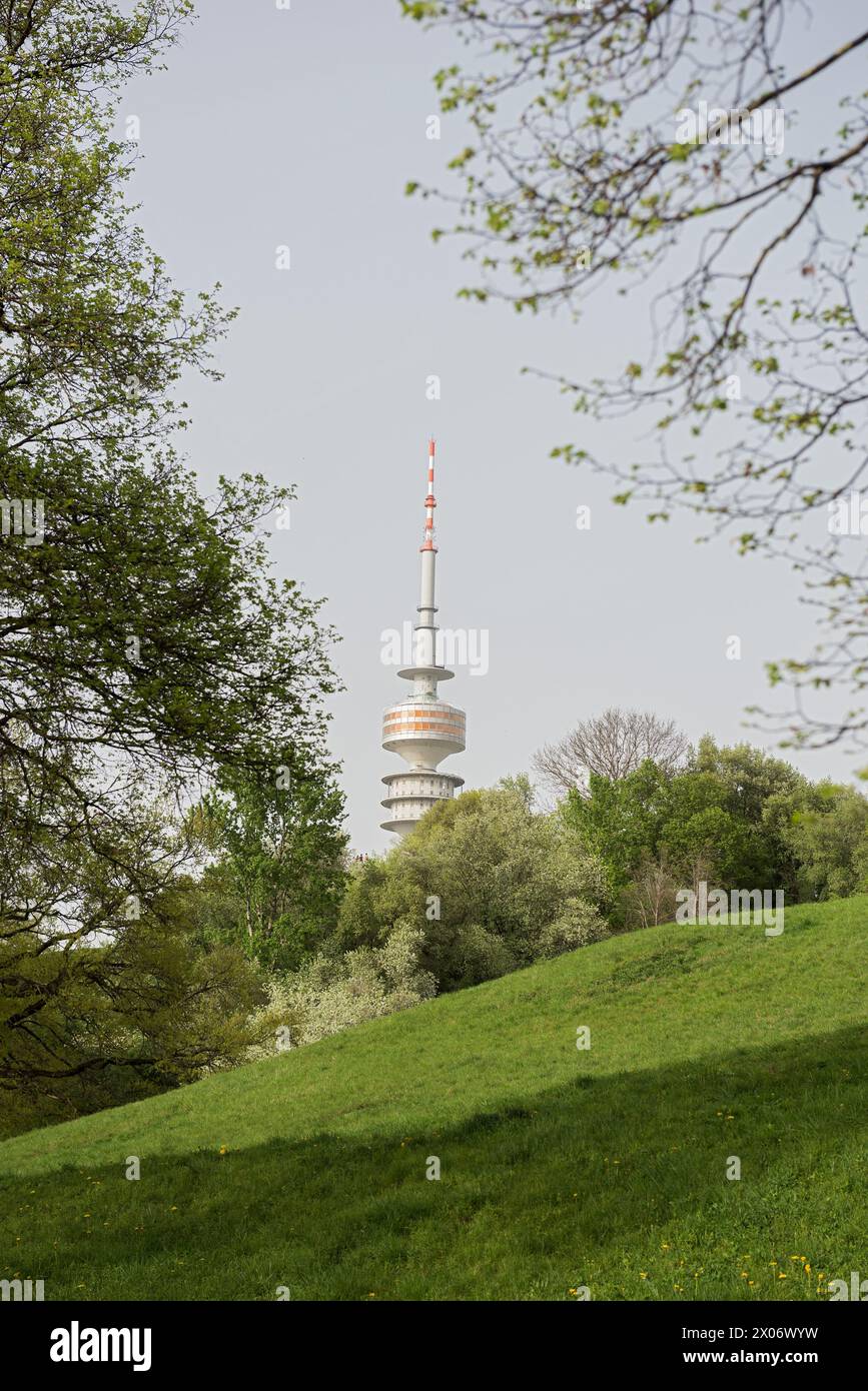 Olympiapark München, Olympic Hill with Olympic Tower Stock Photo - Alamy
