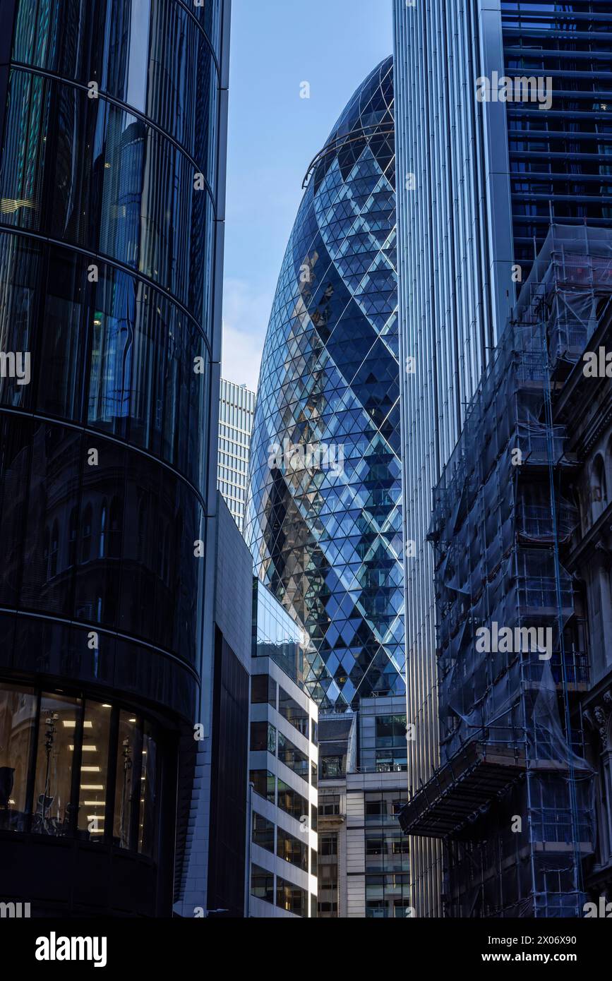 The Gherkin building appears behind other office buildings in City of ...