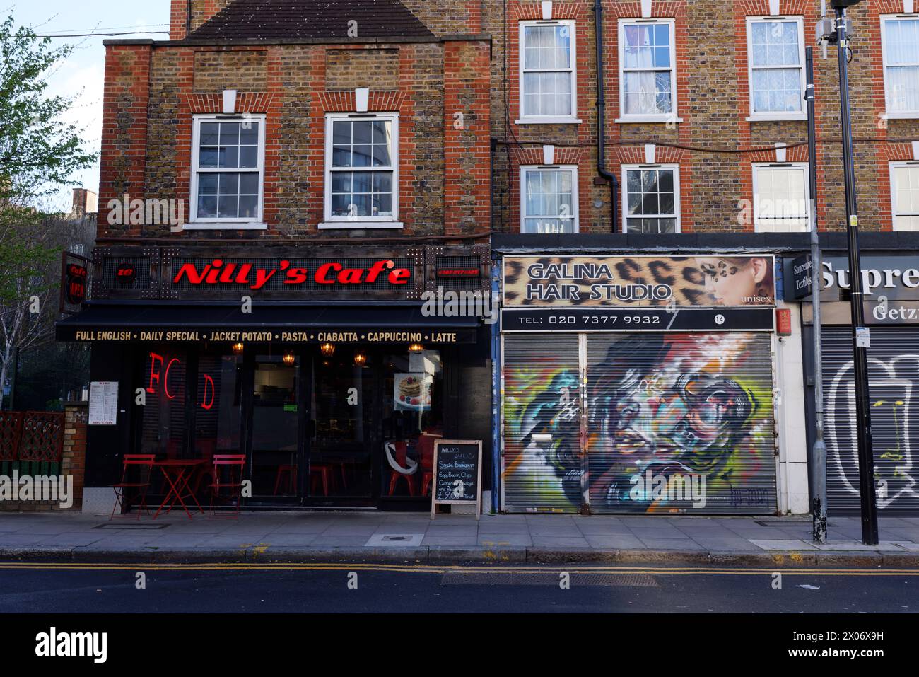 Cafe and shops in Bell Lane, Spitalfields East End area of Tower ...