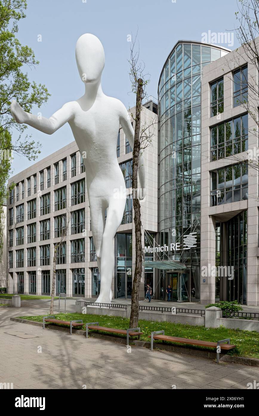 Building of the MUNICH RE Foundation with "Walking Man" Art Scuplture ...