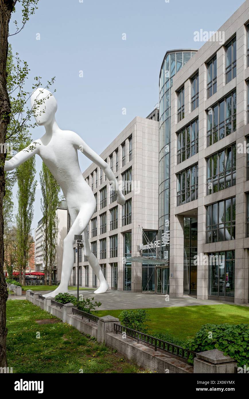 Building of the MUNICH RE Foundation with "Walking Man" Art Scuplture ...