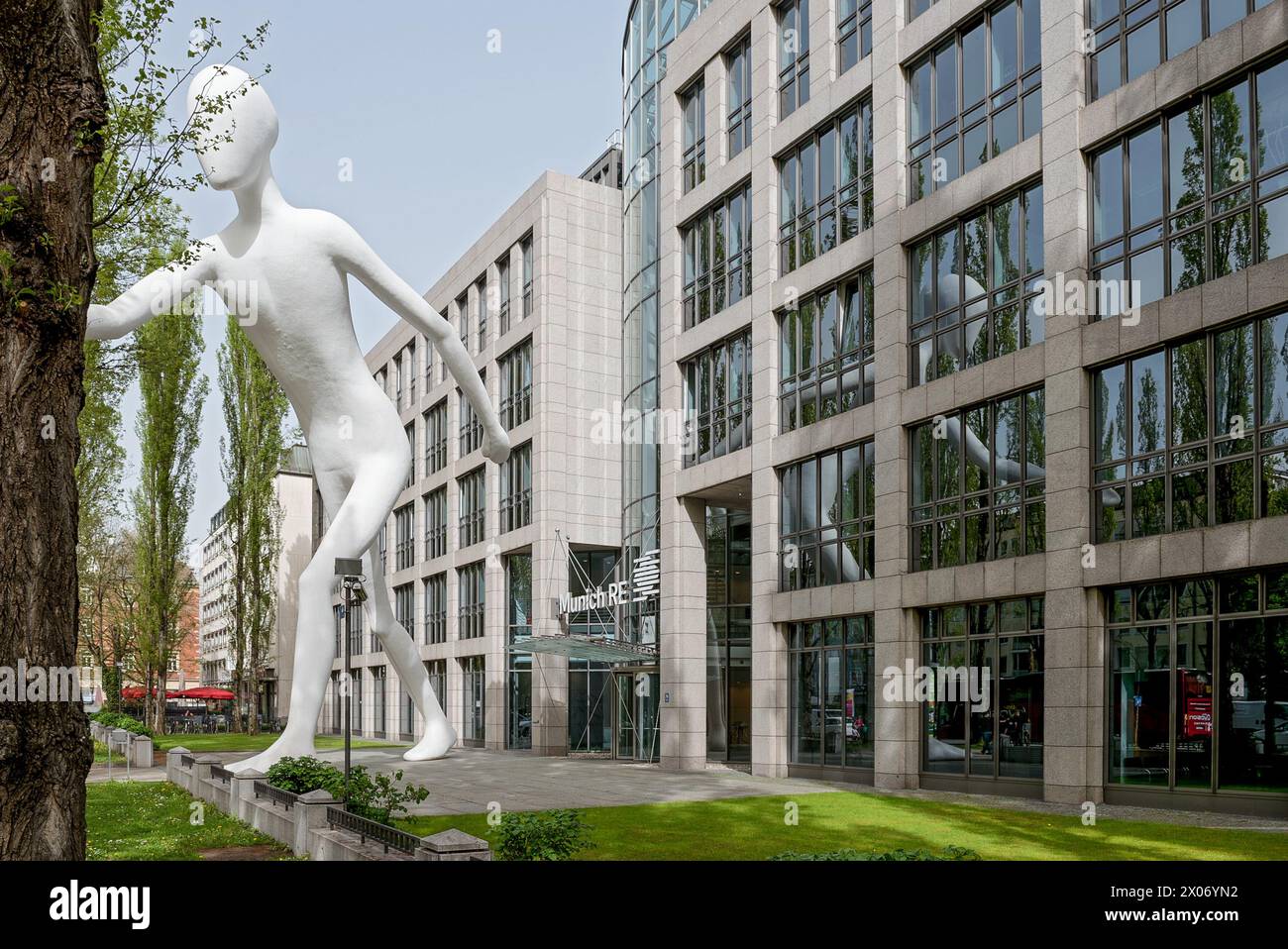 Building of the MUNICH RE Foundation with "Walking Man" Art Scuplture ...