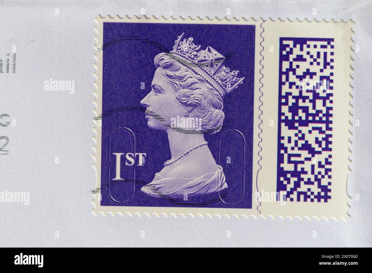 purple 1st class stamp with Queen Elizabeth II head, stuck on envelope ...