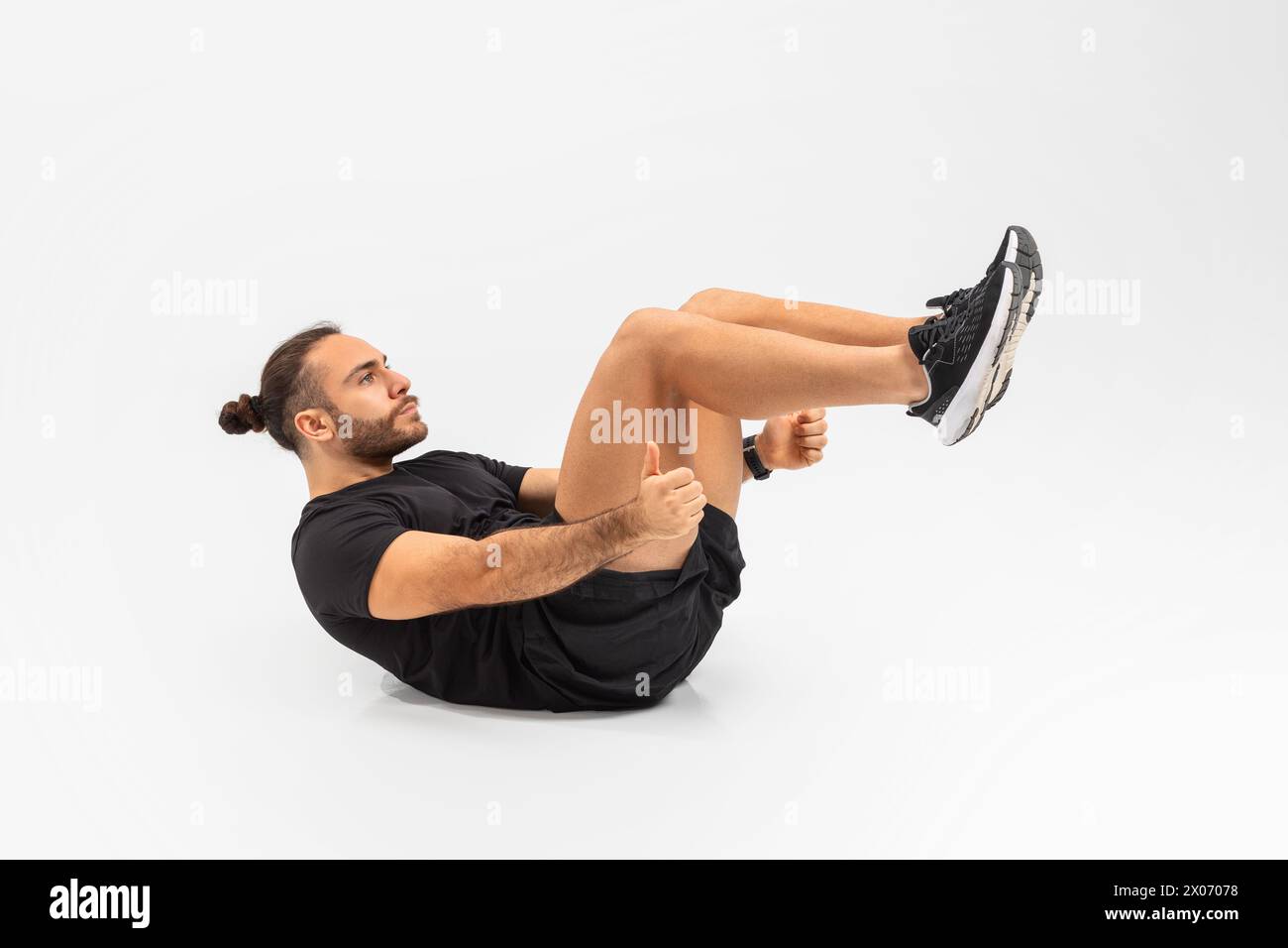 Fit man doing a floating crunch exercise Stock Photo - Alamy