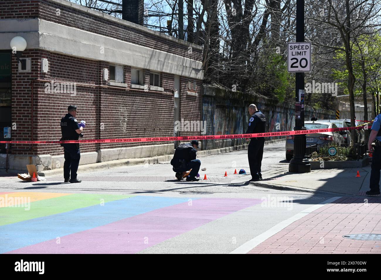 Police officers from the Chicago Police Department mark where shell ...