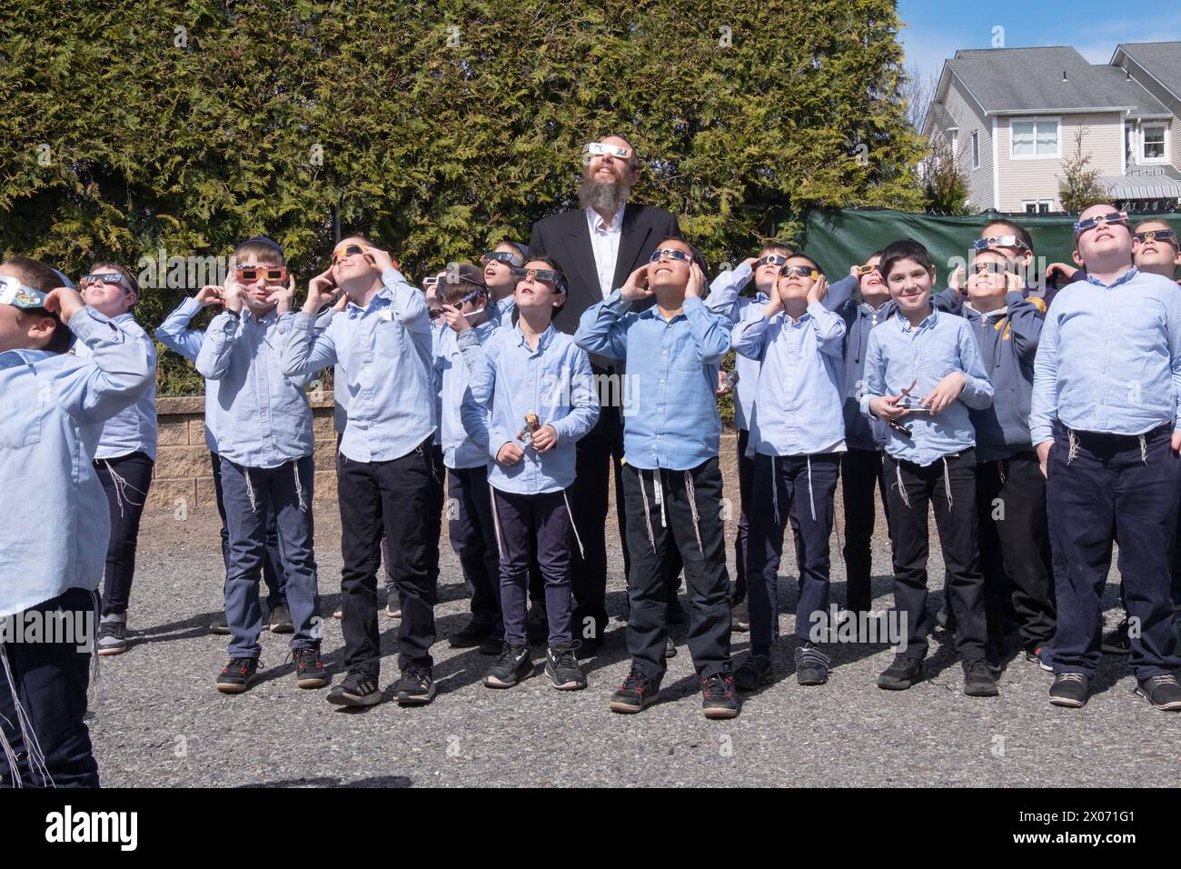 Jewish yeshiva students & their Rabbi teachers watch the 2024 solar ...