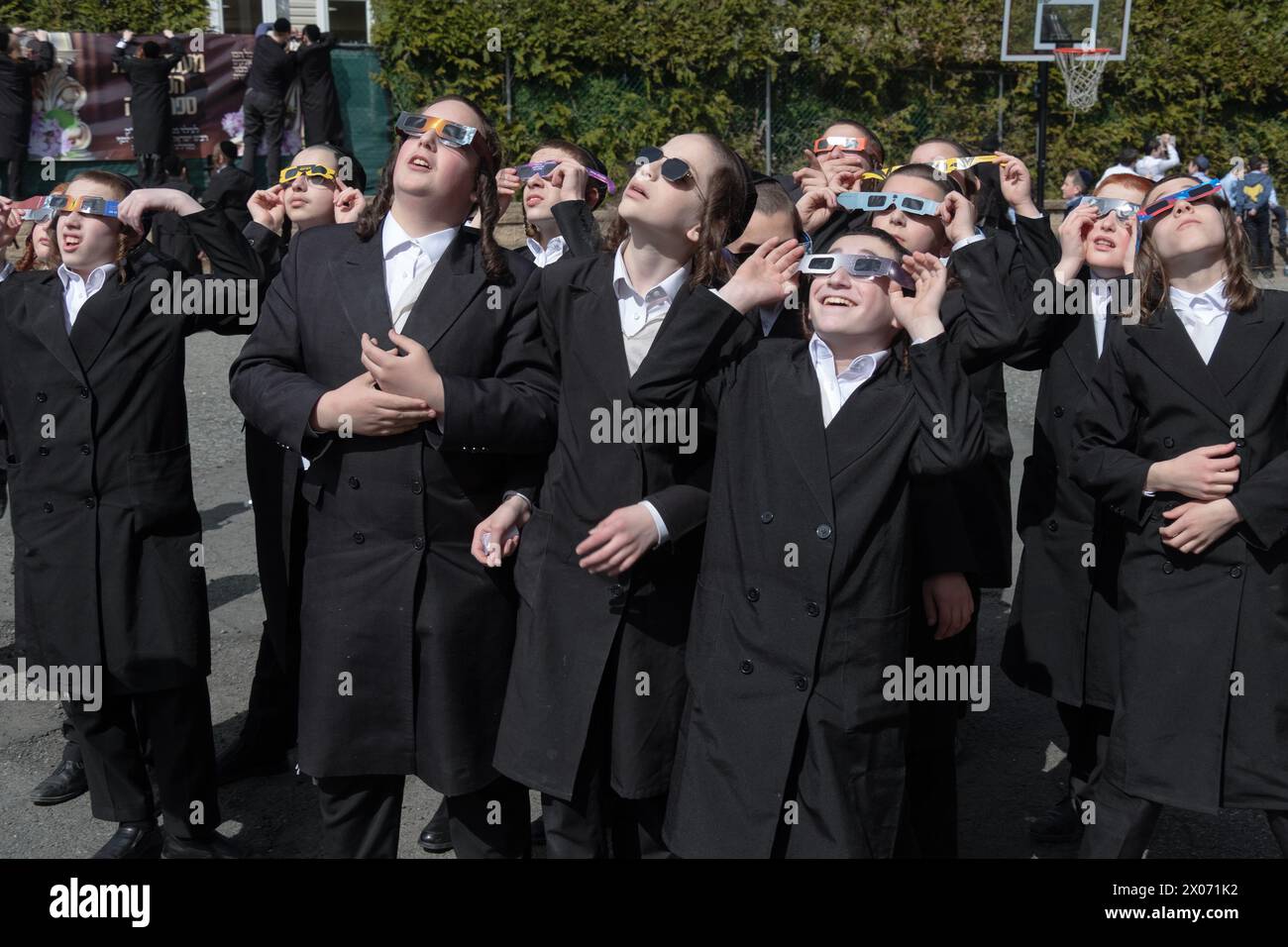 A group of orthodox Jewish boys watch the 2024 solar eclipse from the ...