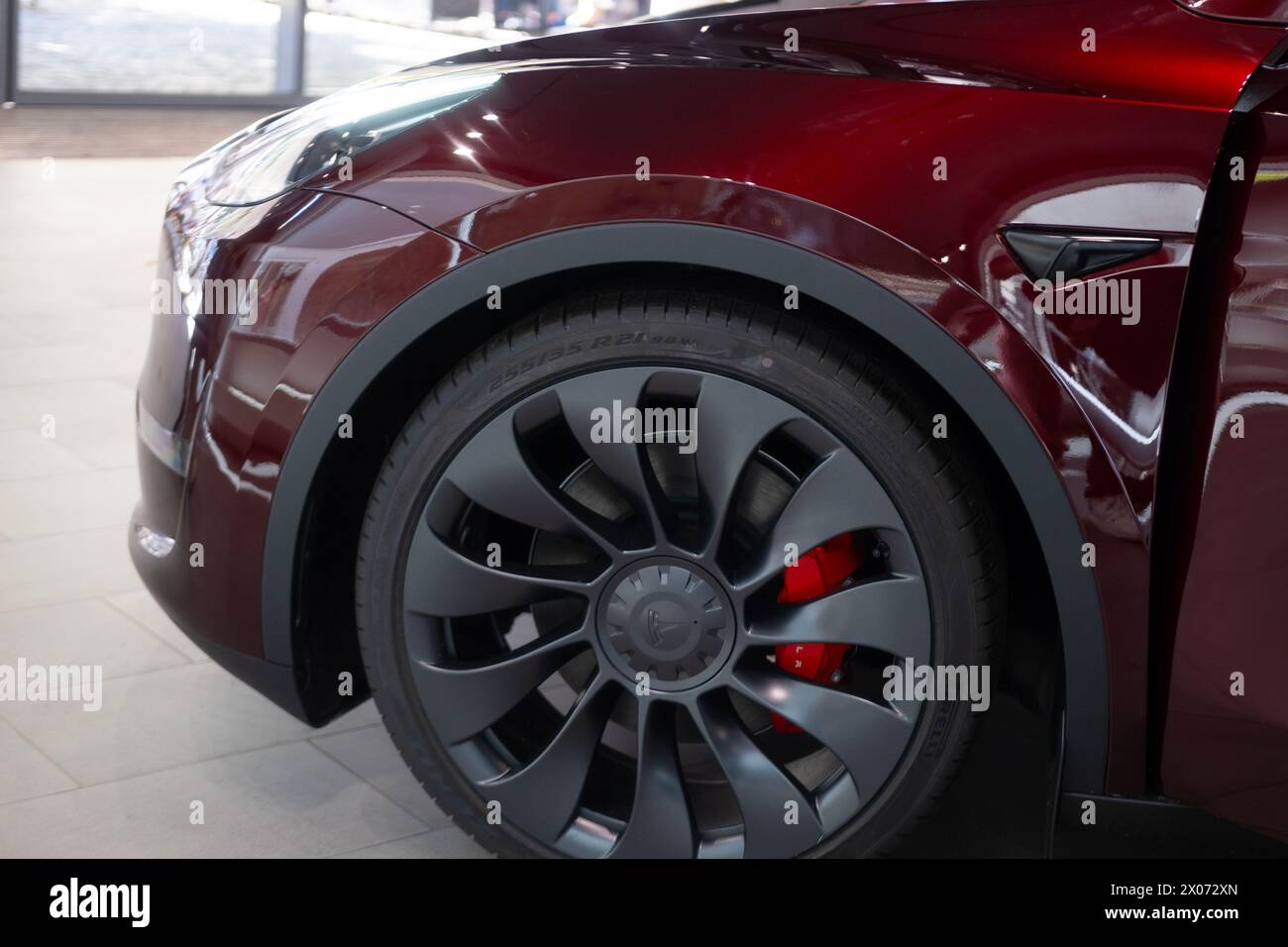 Tesla car model Y in cherry red color in Studio, electric vehicle in ...