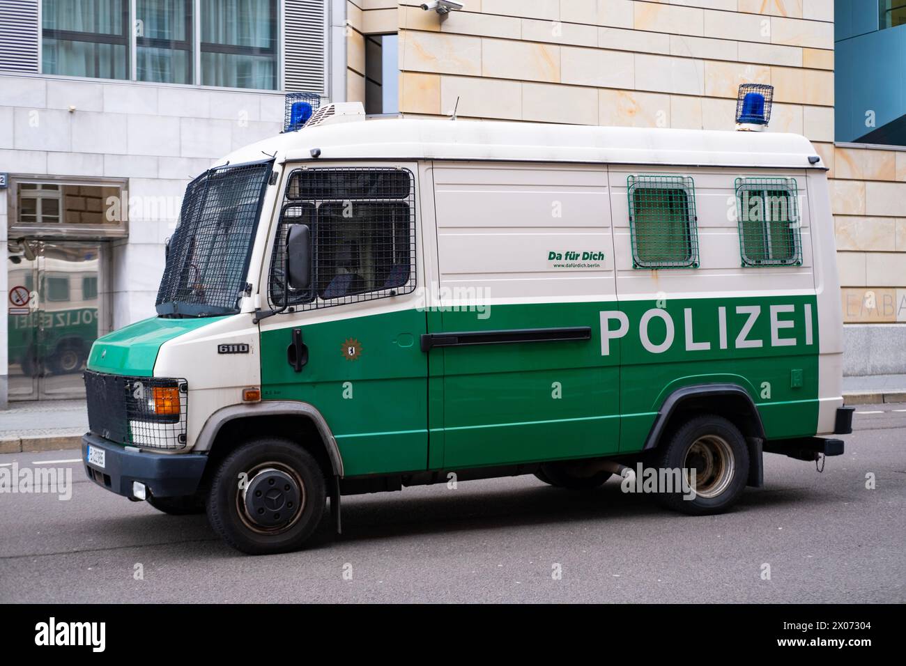 white and green police bus parked on street in Berlin near British ...