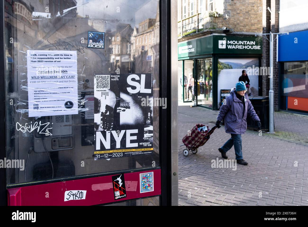 An ugly public telephone box covered in stickers in Newquay town centre ...