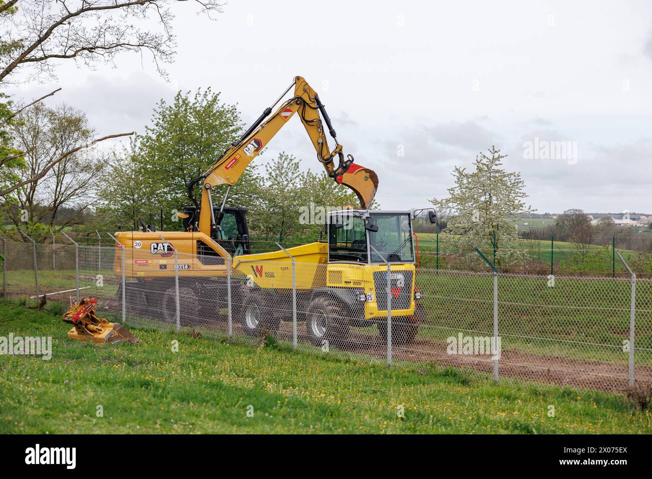 Katterbach, Germany. 10th Apr, 2024. Construction site vehicles are ...