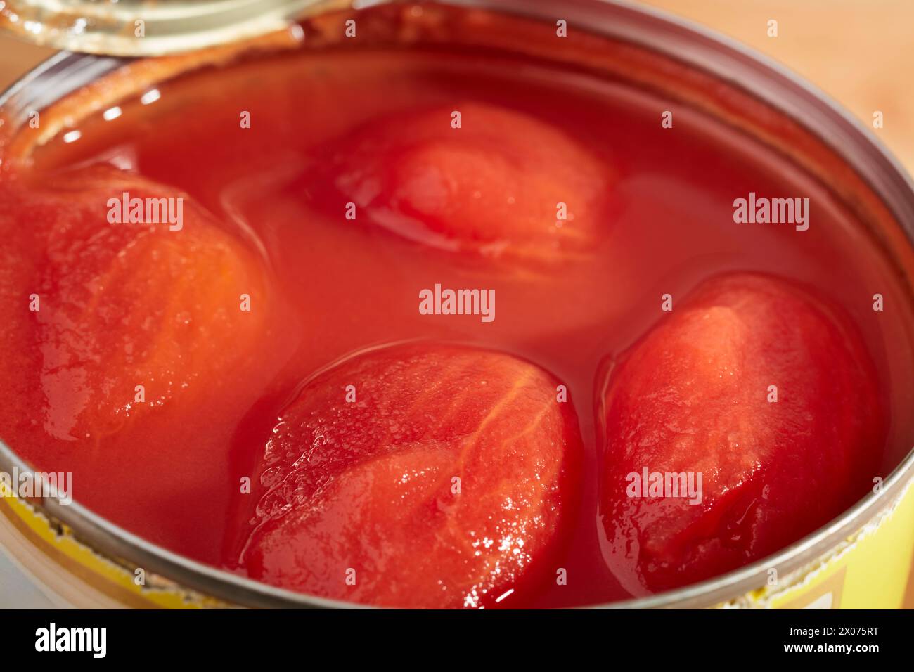 an open can of plum tomatoes Stock Photo - Alamy