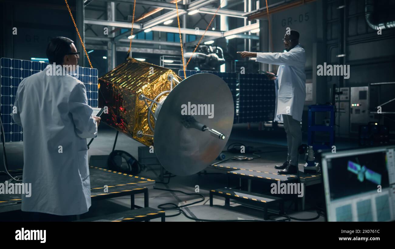 Engineer and Technician Working on Satellite Construction. Aerospace ...