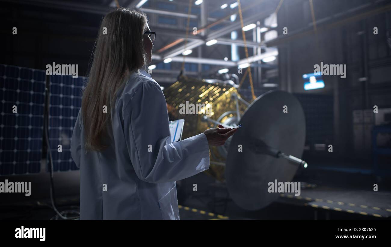 Industrial Female Engineer Working on Artificial Satellite Construction ...