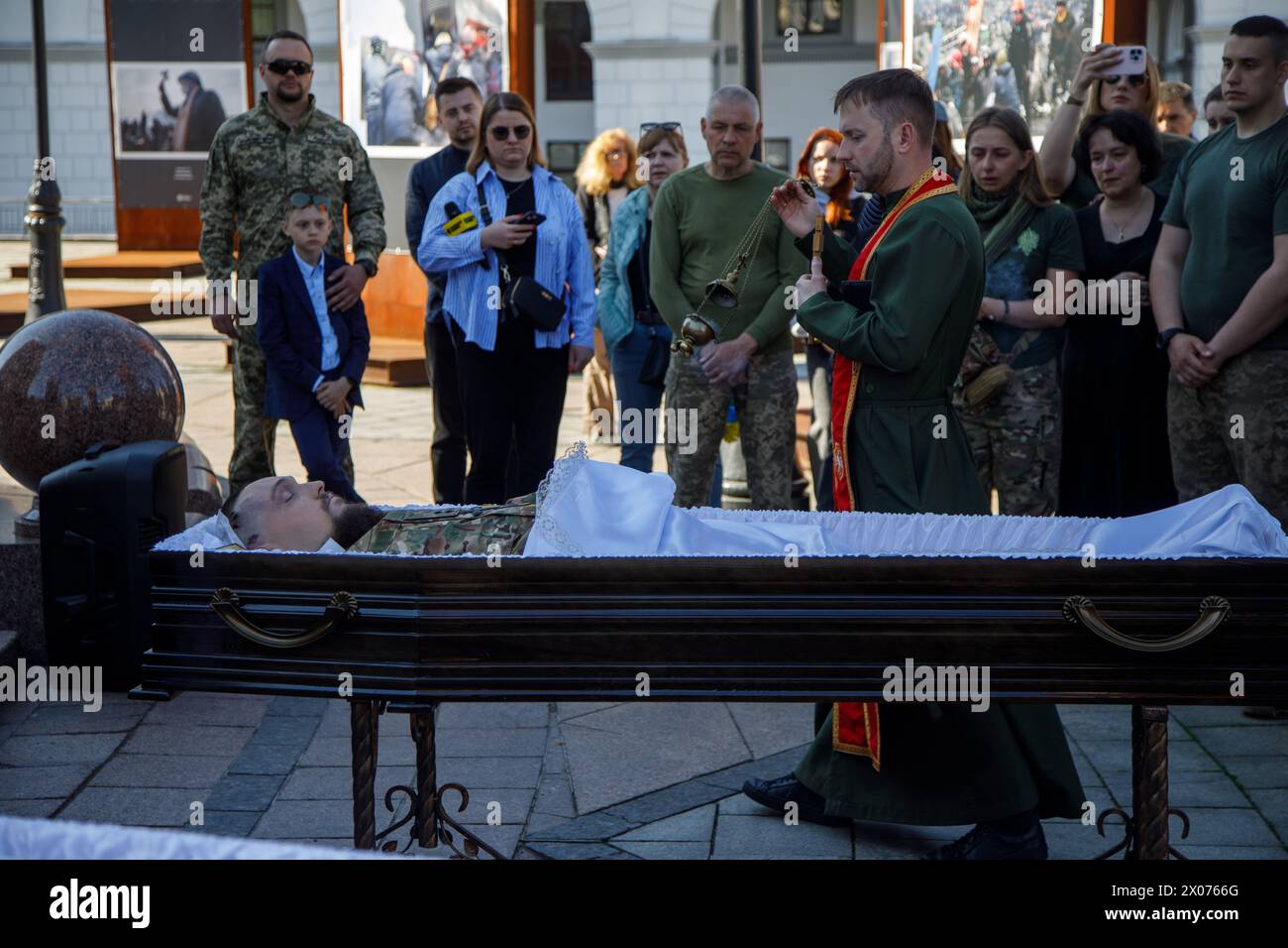KYIV, UKRAINE - APRIL 9, 2024 - A priest partakes in the farewell ...