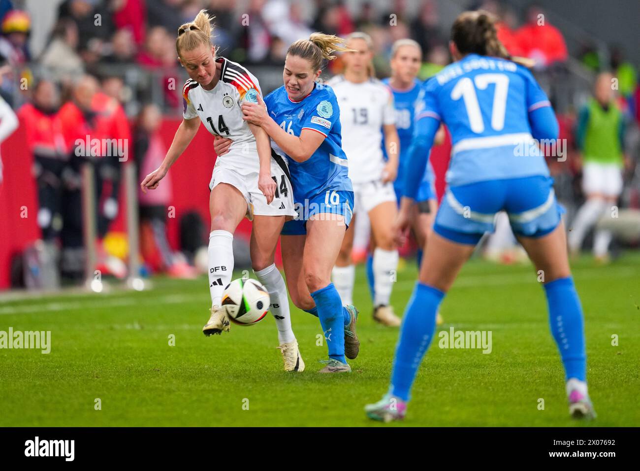 AACHEN, GERMANY - APRIL 9: Janina Minge of Germany battles for the ball ...