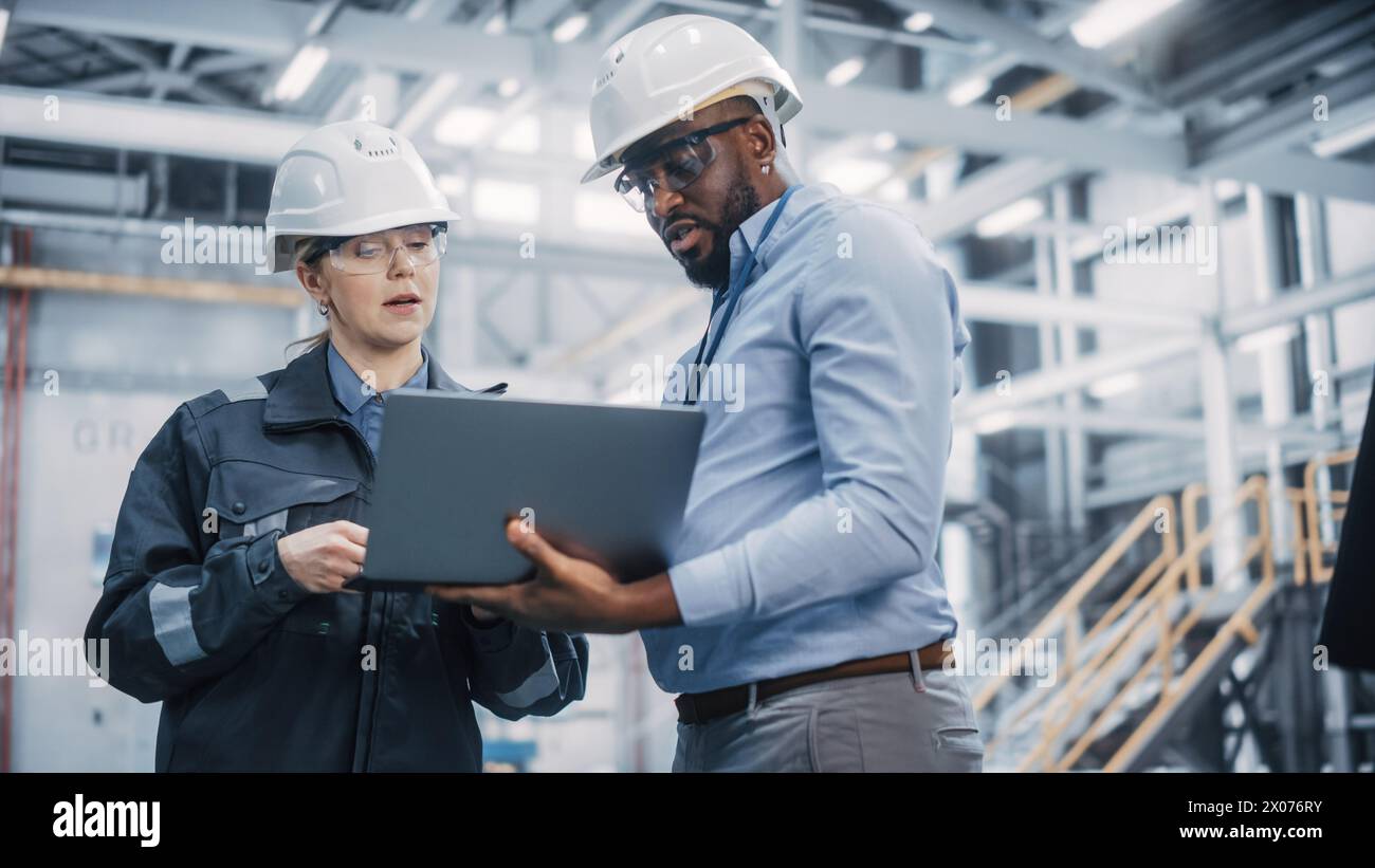 Two Diverse Professional Heavy Industry Engineers Wearing Safety ...