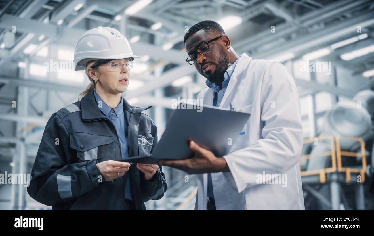 Team of Diverse Professional Heavy Industry Engineers Wearing Safety ...