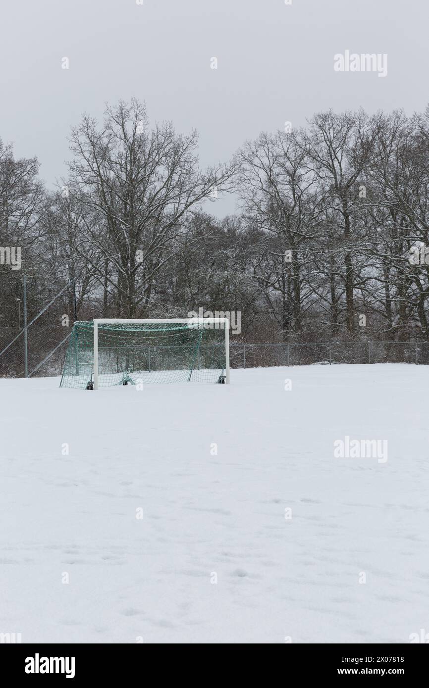 An empty football field covered on snow Stock Photo - Alamy