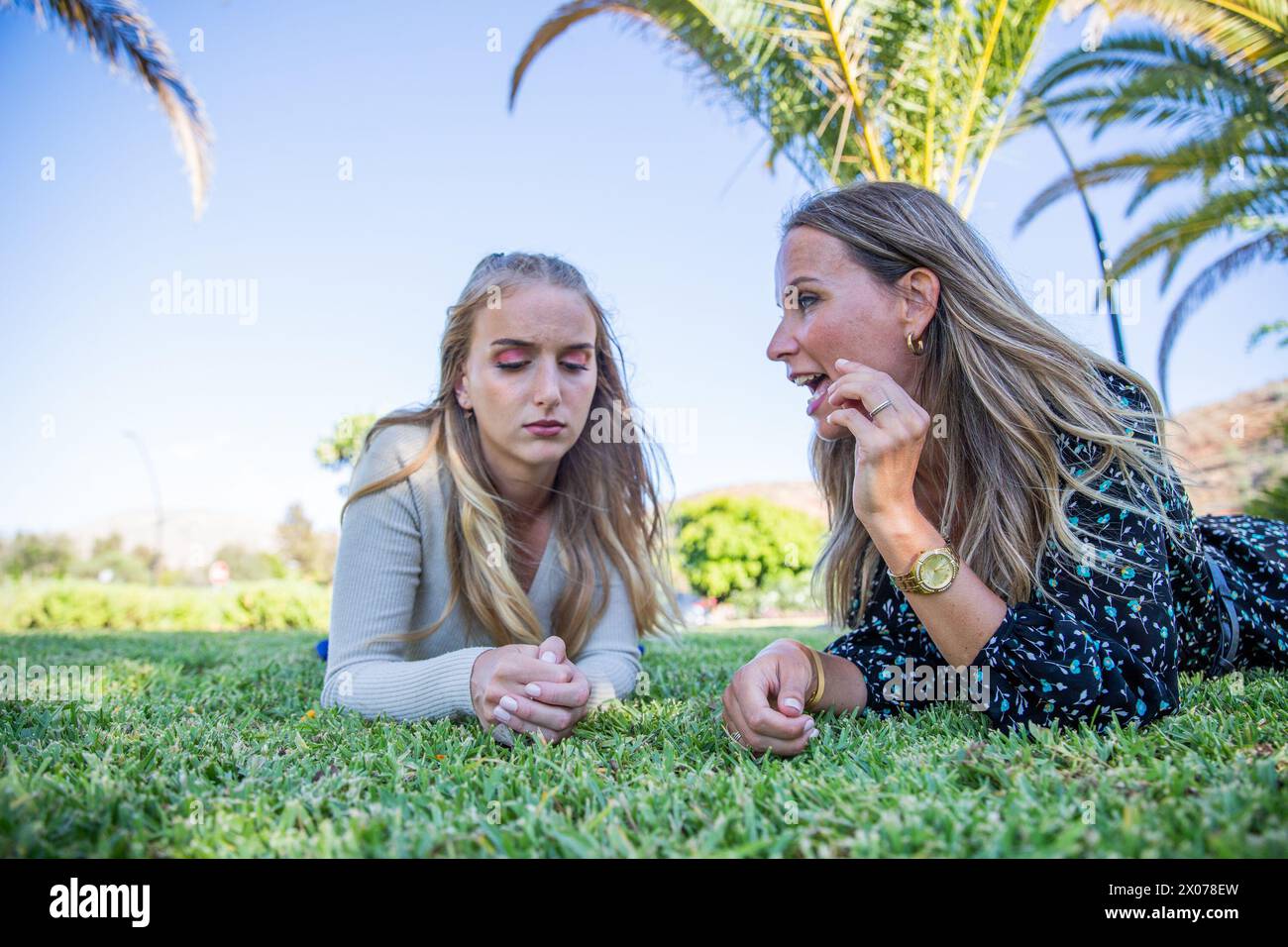 Mother scolds her daughter while they are in a public park, child ...