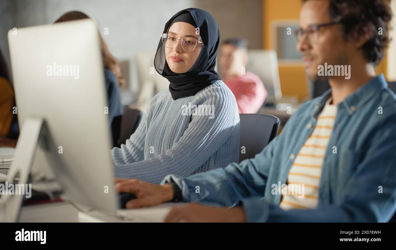 Curious Female Muslim Student Wearing a Hijab, Studying in Modern ...