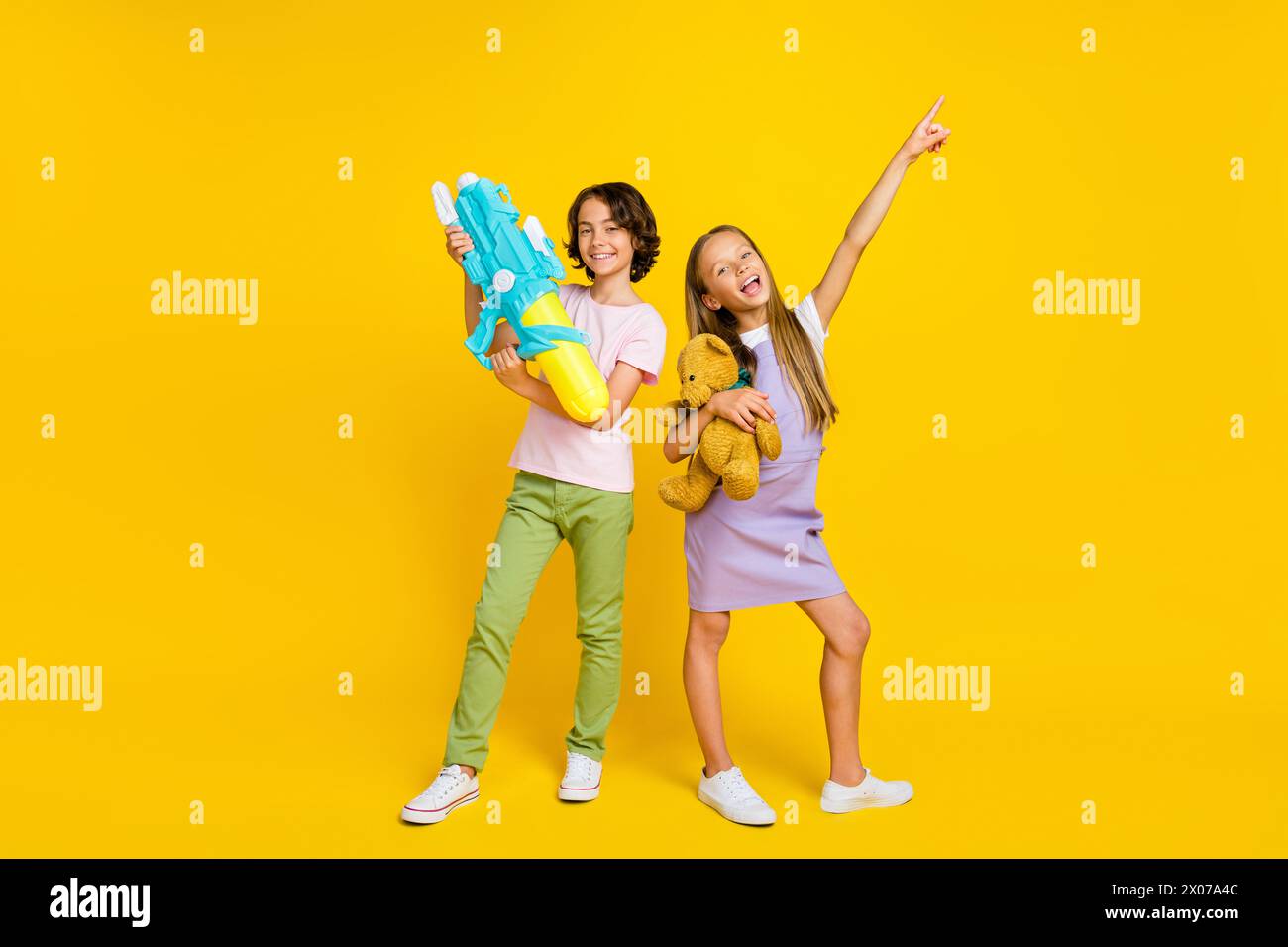 Full length photo of dreamy funky friends wear casual outfits playing ...