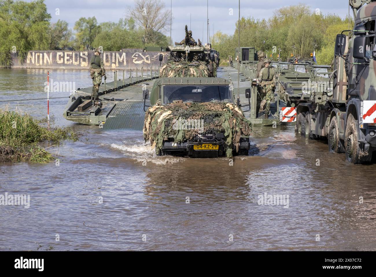 Netherlands, Olst, 10-04-2024, - Army vehicles cross the IJssel on ...