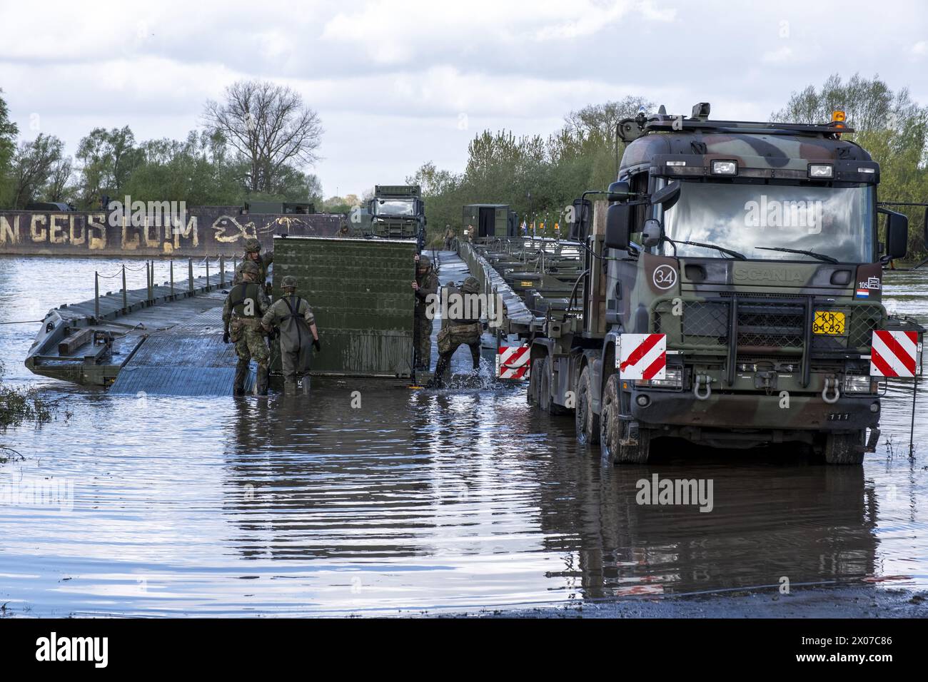Netherlands, Olst, 10-04-2024, - Army vehicles cross the IJssel on ...