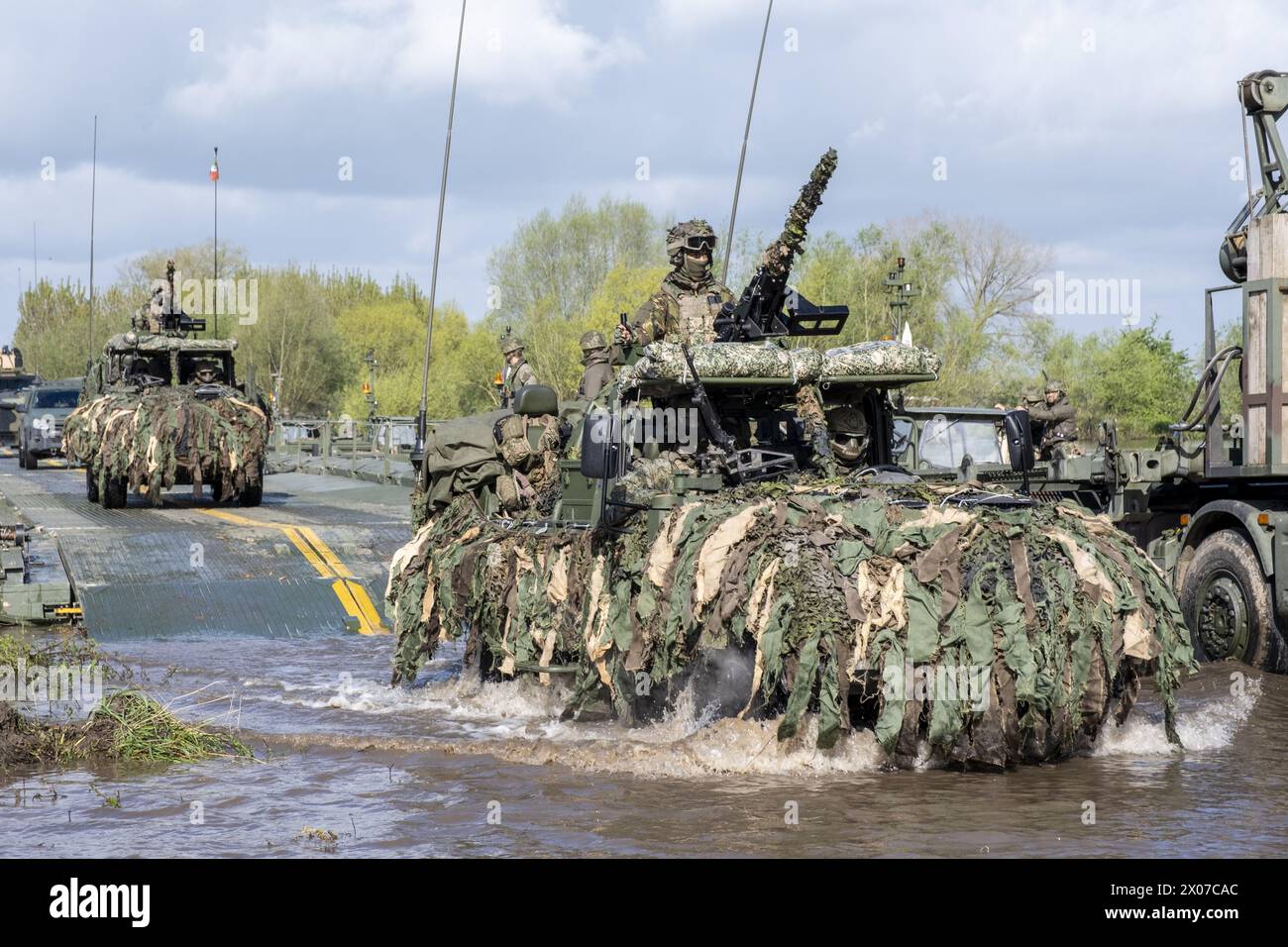Netherlands, Olst, 10-04-2024, - Army vehicles cross the IJssel on ...