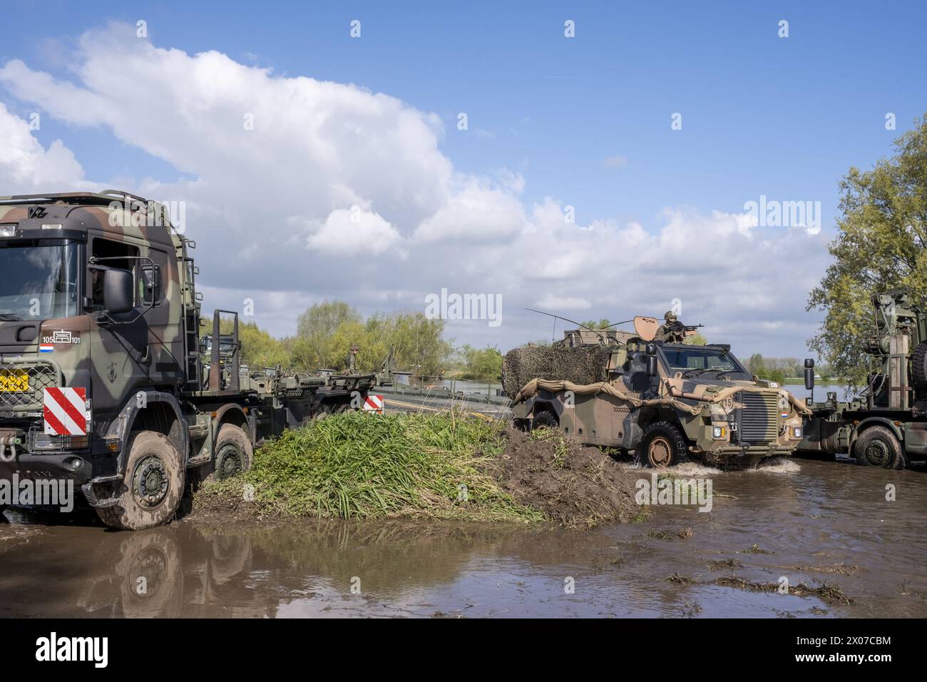 Netherlands, Olst, 10-04-2024, - Army vehicles cross the IJssel on ...