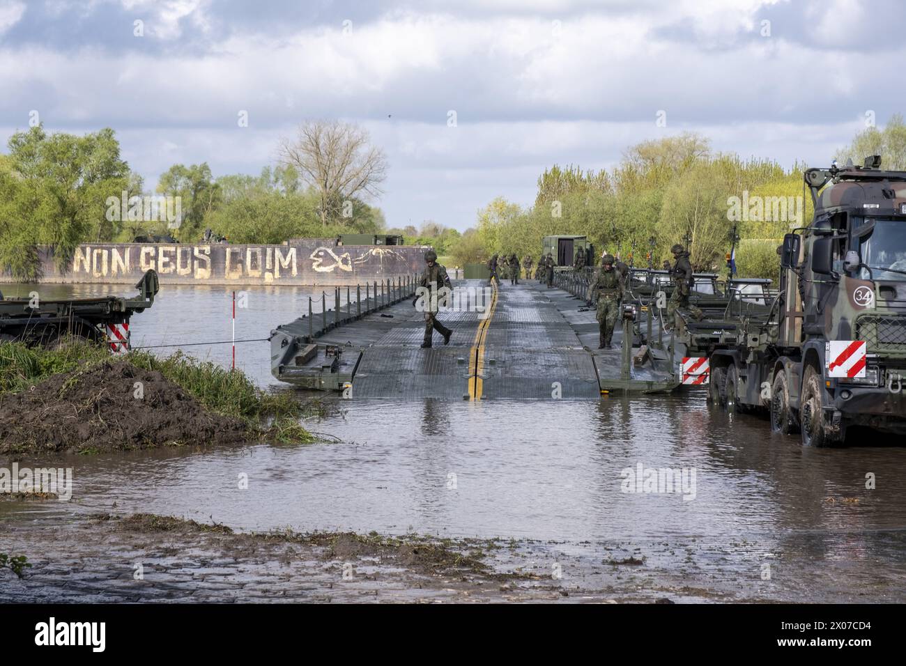 Netherlands, Olst, 10-04-2024, - Army vehicles cross the IJssel on ...