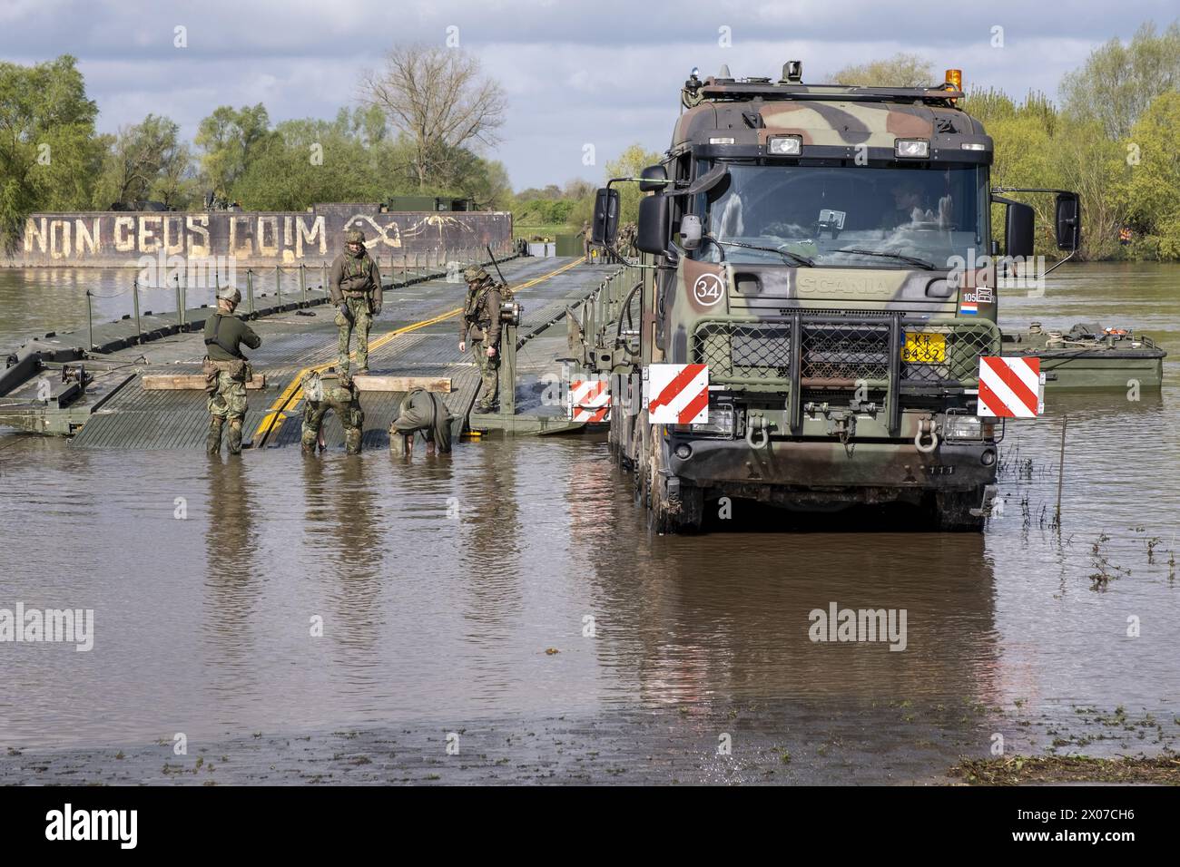 Netherlands, Olst, 10-04-2024, - Army vehicles cross the IJssel on ...