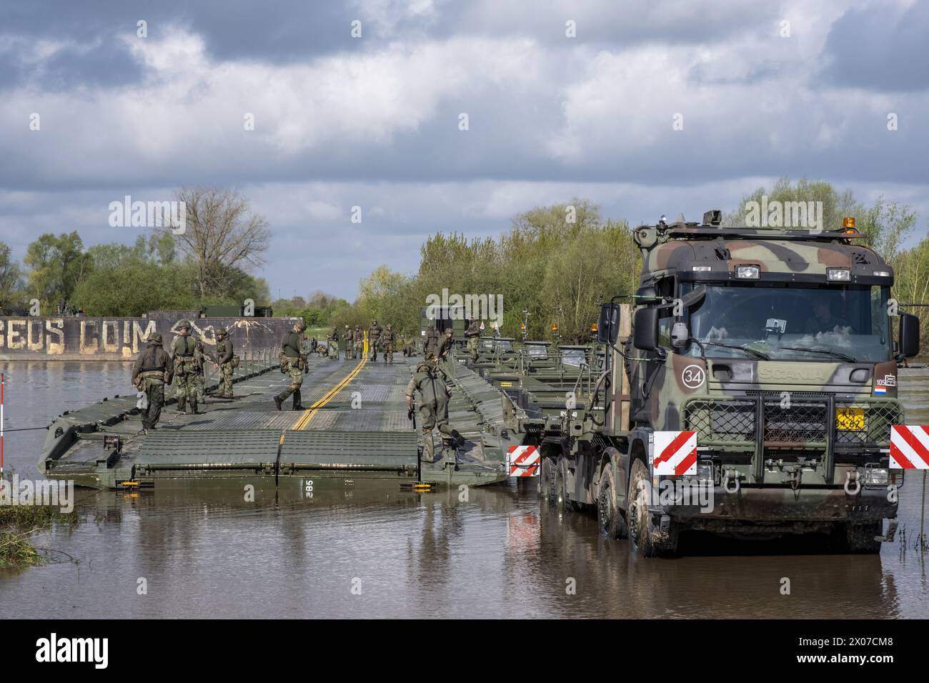 Netherlands, Olst, 10-04-2024, - Army vehicles cross the IJssel on ...