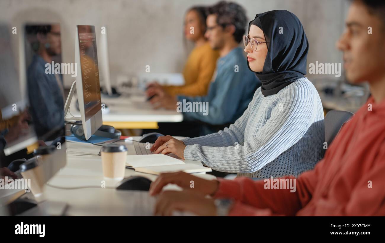 Curious Female Muslim Student Wearing a Hijab, Studying in Modern ...