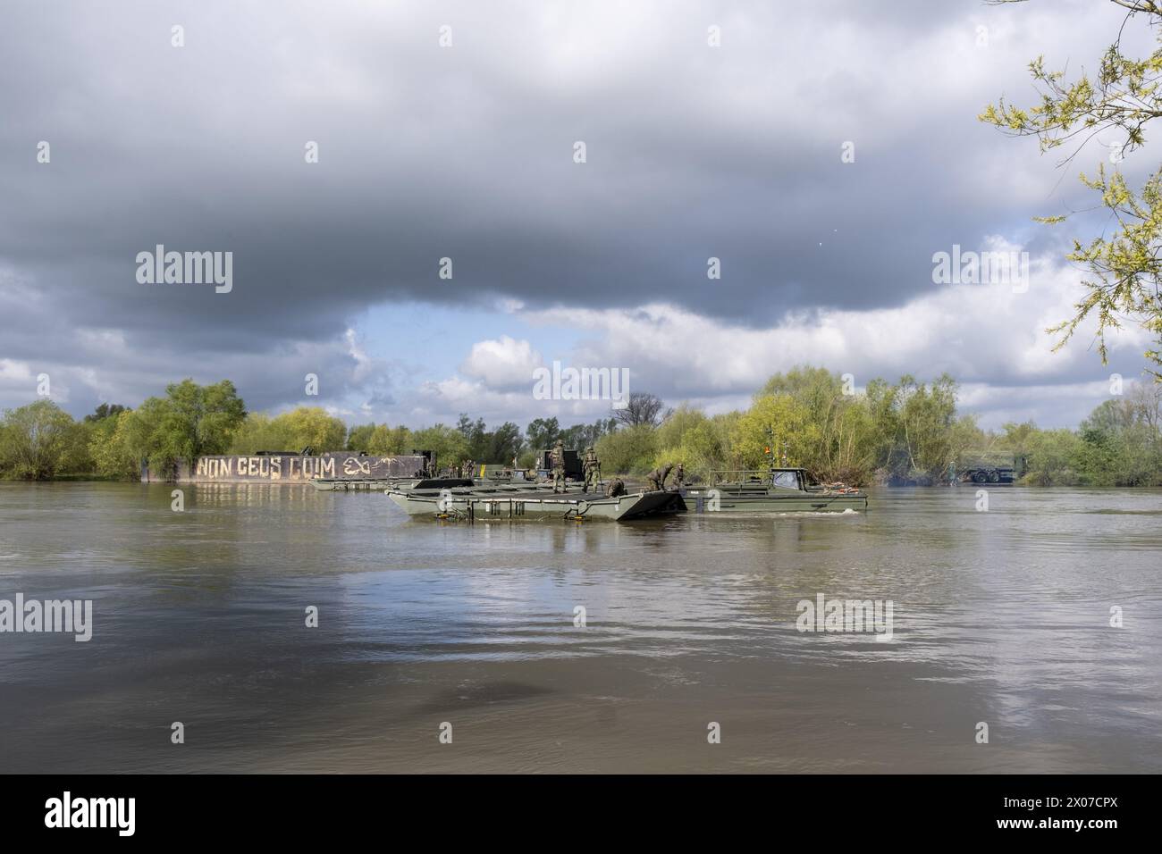 Netherlands, Olst, 10-04-2024, - Army vehicles cross the IJssel on ...