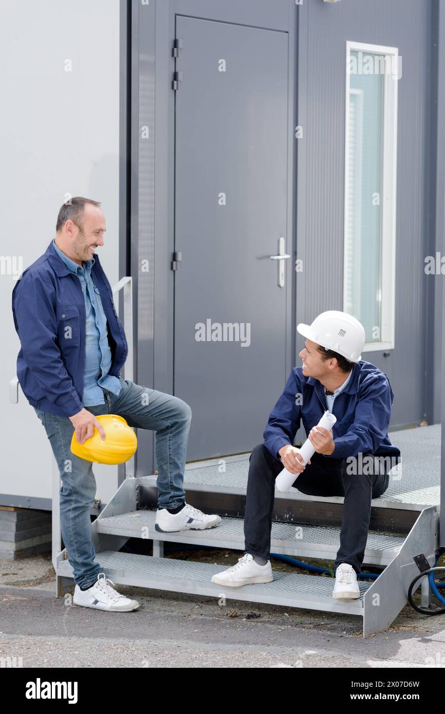 Men factory in helmets hi-res stock photography and images - Alamy