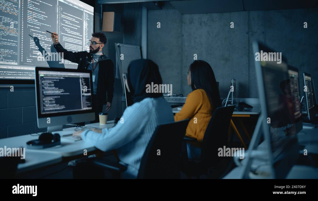 Teacher Giving Computer Science Lecture to Diverse Multiethnic Group of Female and Male Students ...