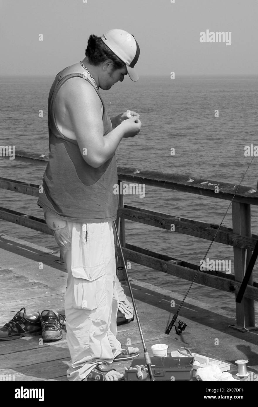 Caucasian man baiting fishing hi-res stock photography and images - Alamy