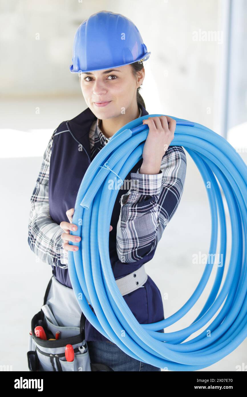 woman is holding pvc pipes Stock Photo - Alamy