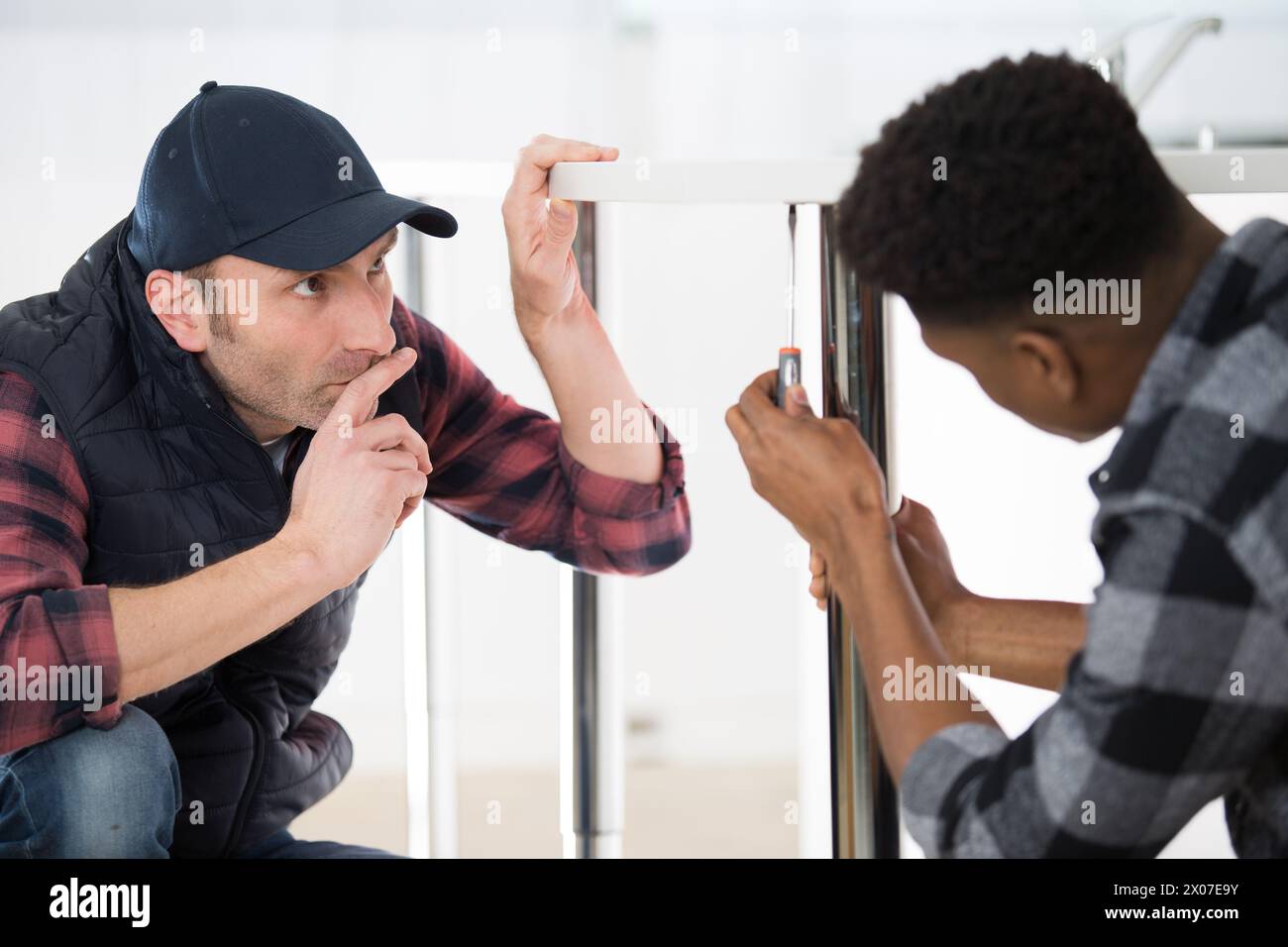 Working under the table hi-res stock photography and images - Alamy