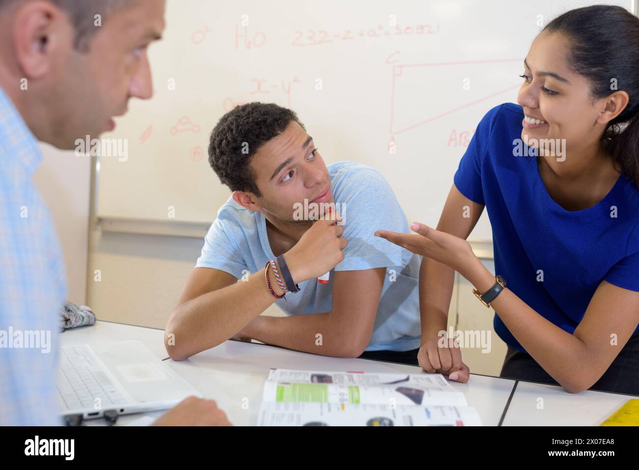 teacher and students in classroom Stock Photo - Alamy