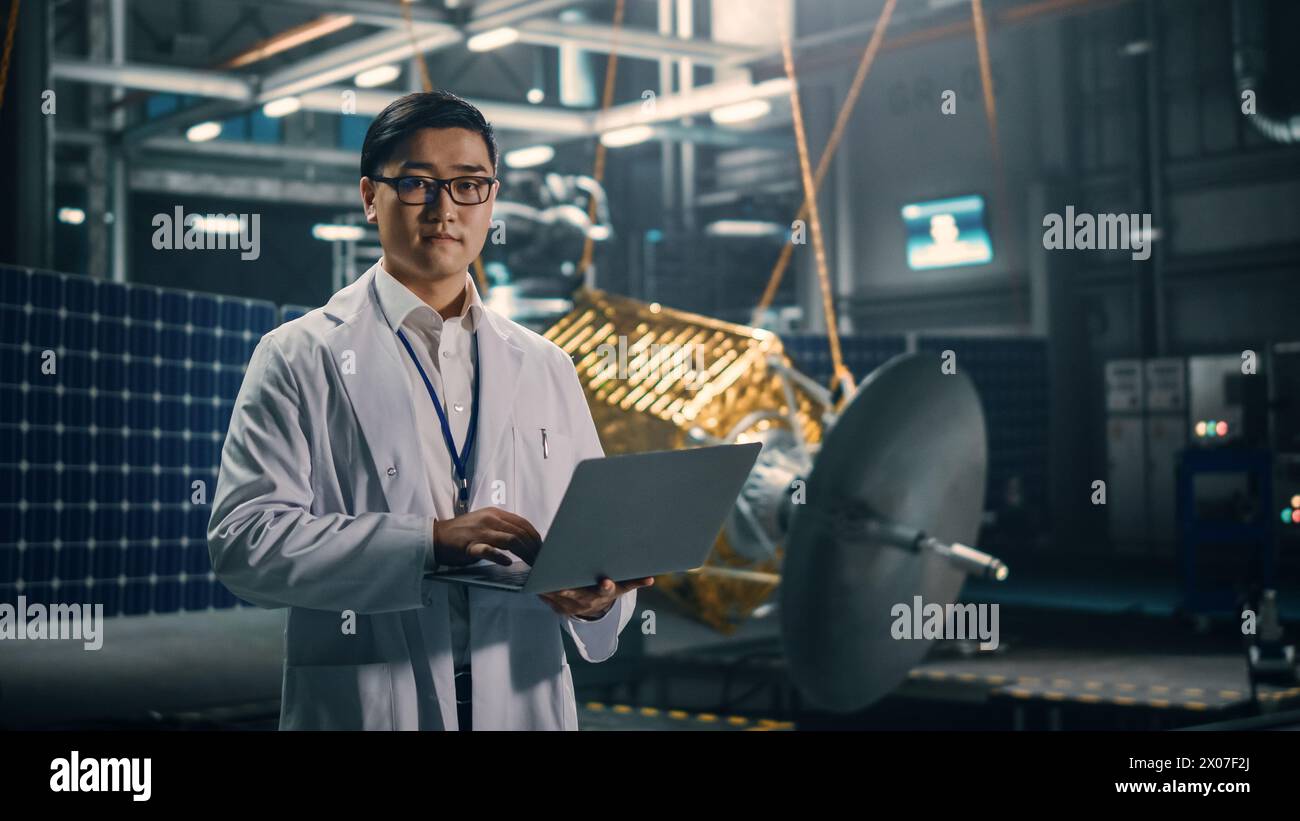 Portrait of Serious Asian Engineer Working on Artificial Satellite ...