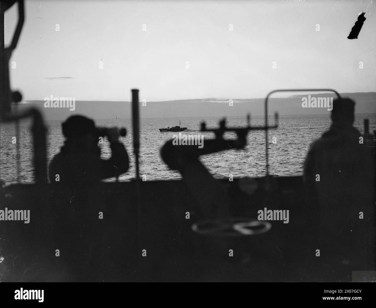 A DESTROYER CARRYING OUT NIGHT SHOOT AT SEA. 19 JANUARY 1942, ON BOARD THE DESTROYER HMS ...