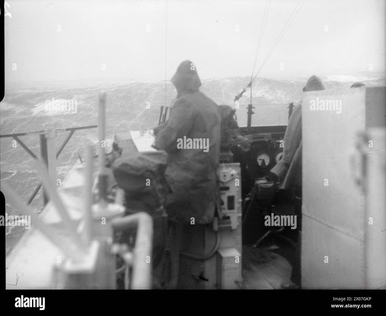 HMS Bellona navigated mountainous seas during a Force 12 gale while on ...