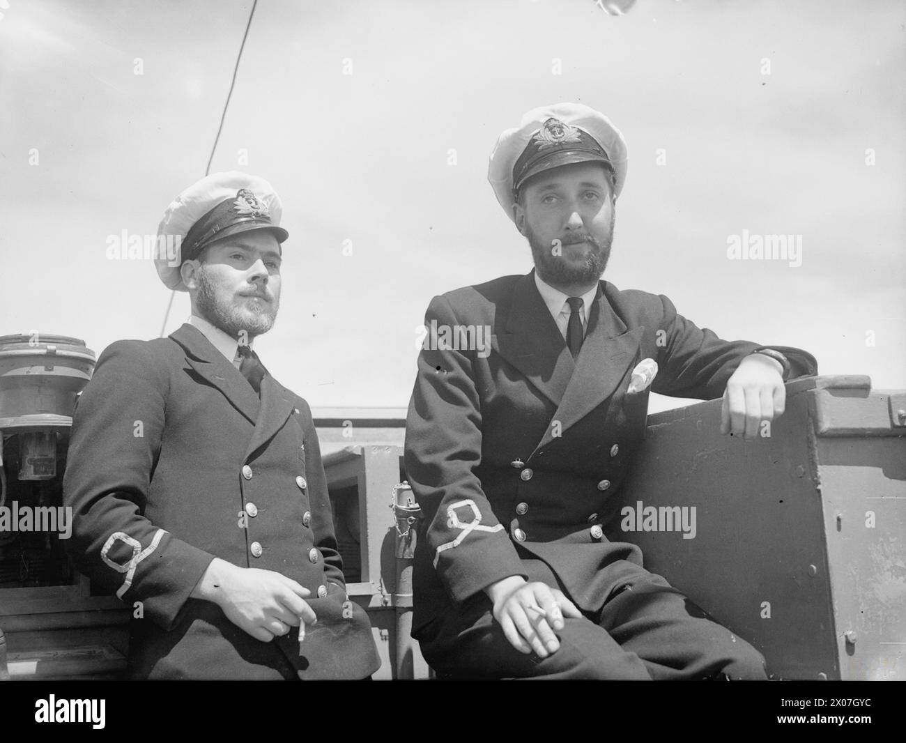 BRITISH MOTOR LAUNCH CREW BOARD TWO ENEMY SHIPS. 20 APRIL 1944, AT HMS ...