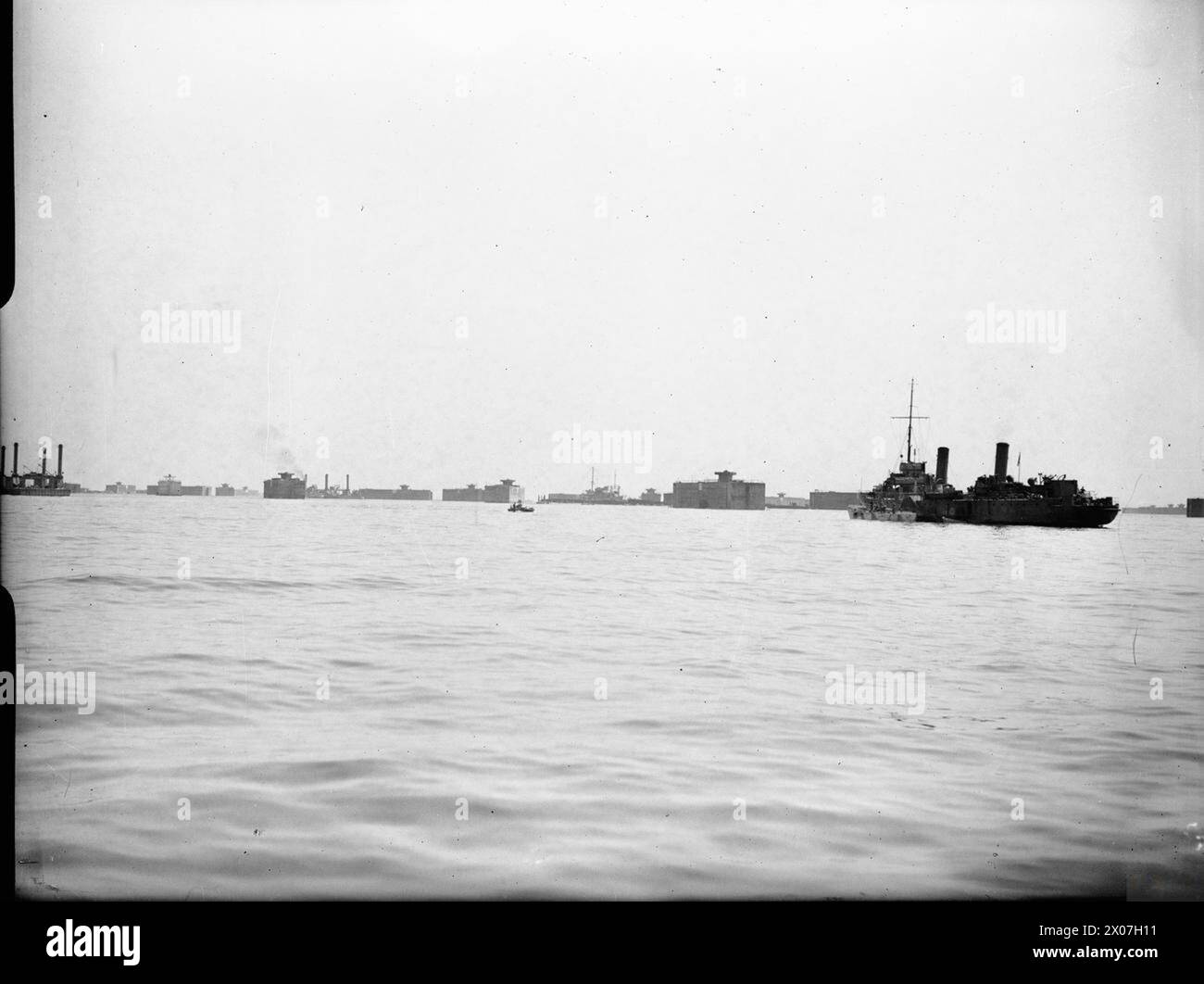 In June 1944, Mulberry Harbour components, including concrete caissons ...
