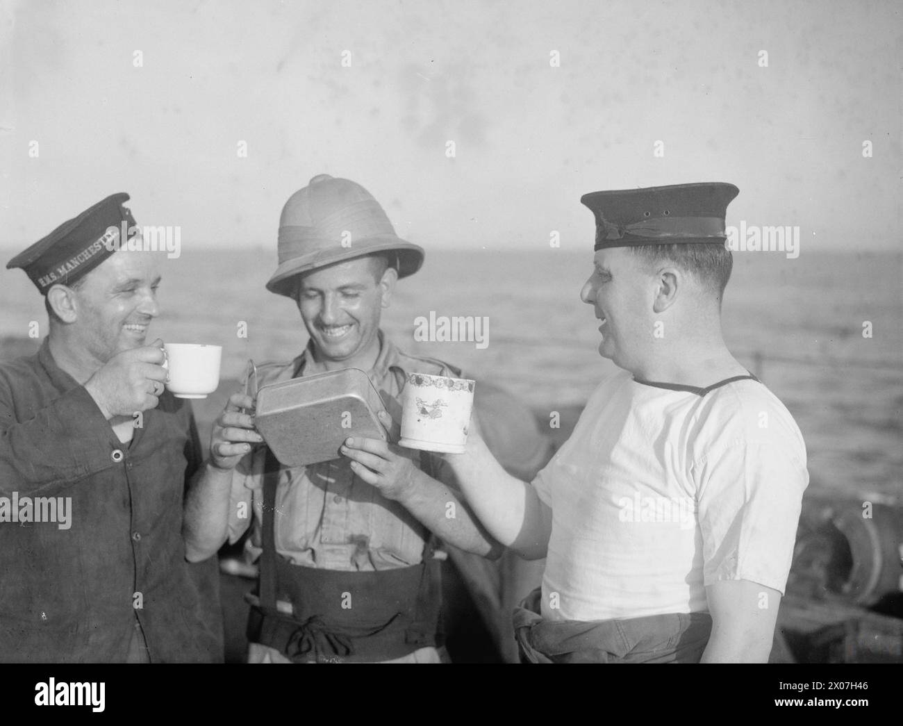 SOLDIERS TAKE PASSAGE IN THE CRUISER HMS MANCHESTER. JULY 1941, ON ...