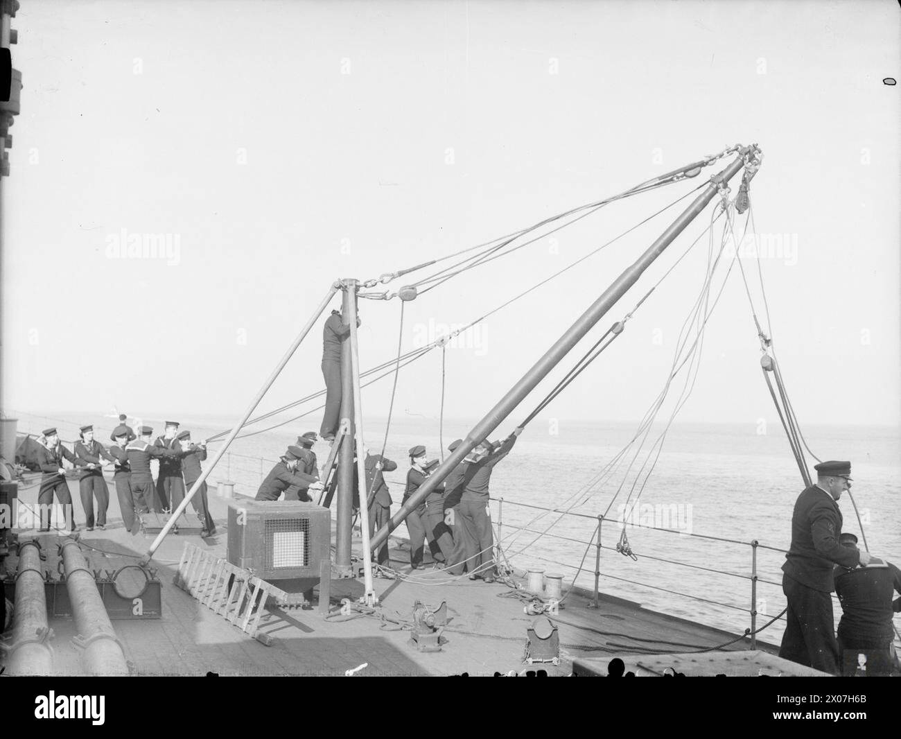 HMS HOWE. AUGUST 1942. - Preparing to recover paravanes on the fo'c's ...
