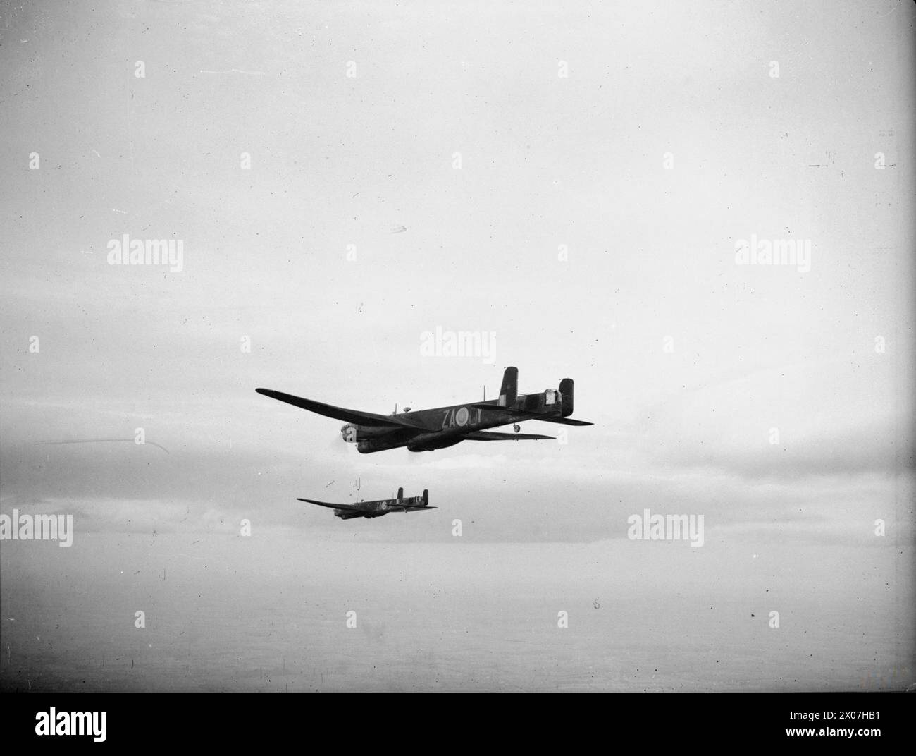ROYAL AIR FORCE BOMBER COMMAND 1939-1941. - Two Armstrong Whitworth Whitley Mark Vs of No. 10 ...