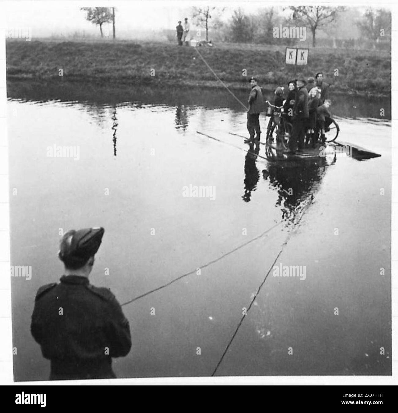 Civilians and Royal Engineers cross a canal near Tilburg on an ...